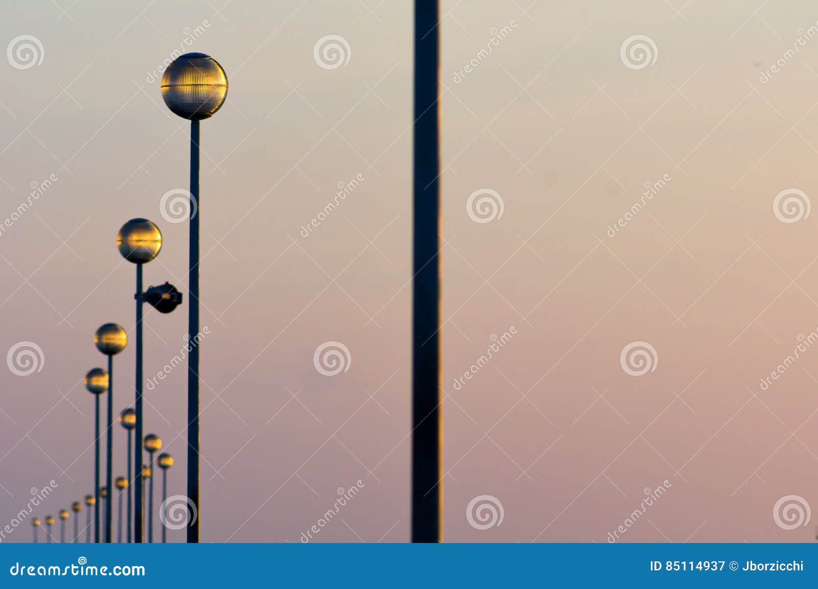 Row of lamp posts stock image. Image of outlined, blue - 85114937