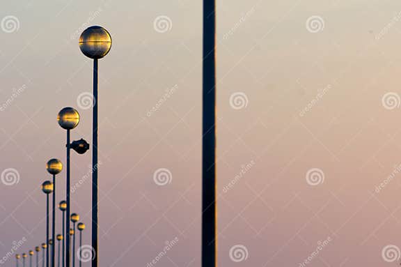 Row of lamp posts stock image. Image of outlined, blue - 85114937