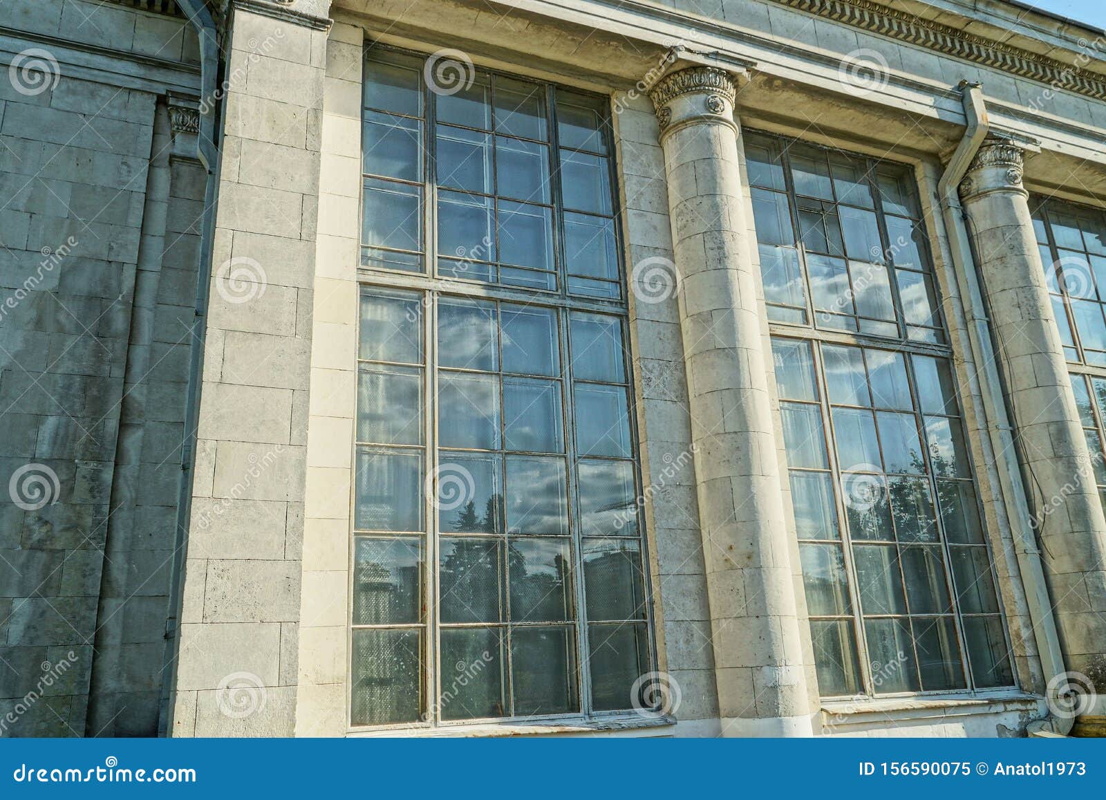 A Row of Large Old Windows on a Gray Stone Wall Stock Image - Image of ...