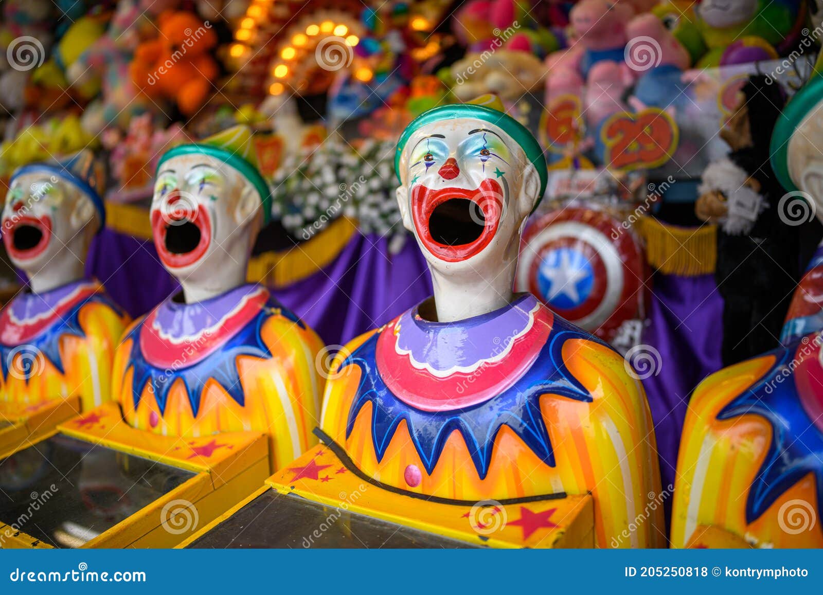A Row of Laughing Clown Faces Stock Photo - Image of mechanical, chance ...