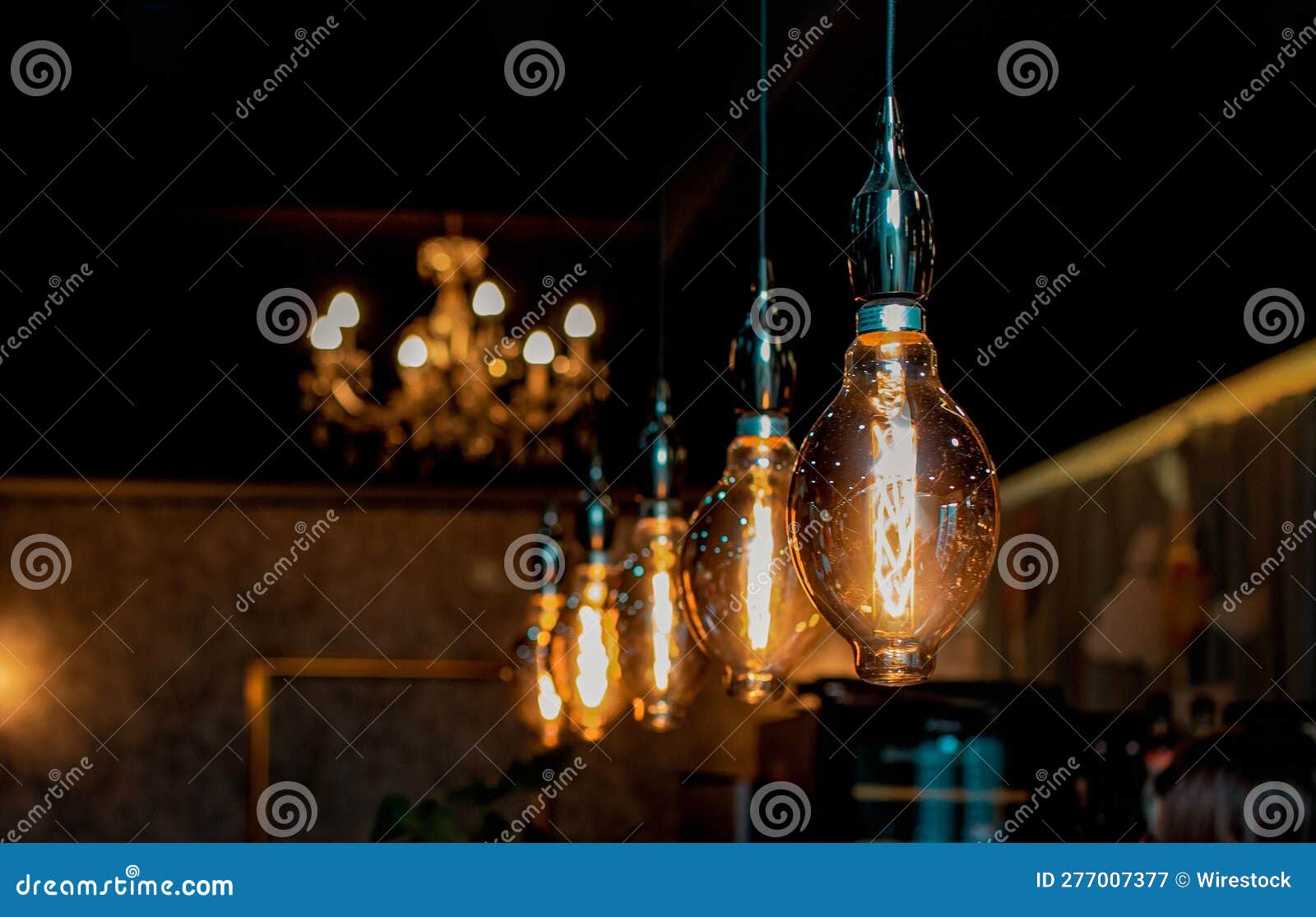 Row of Light Bulbs Hanging from the Ceiling in the Dark Room. Stock ...