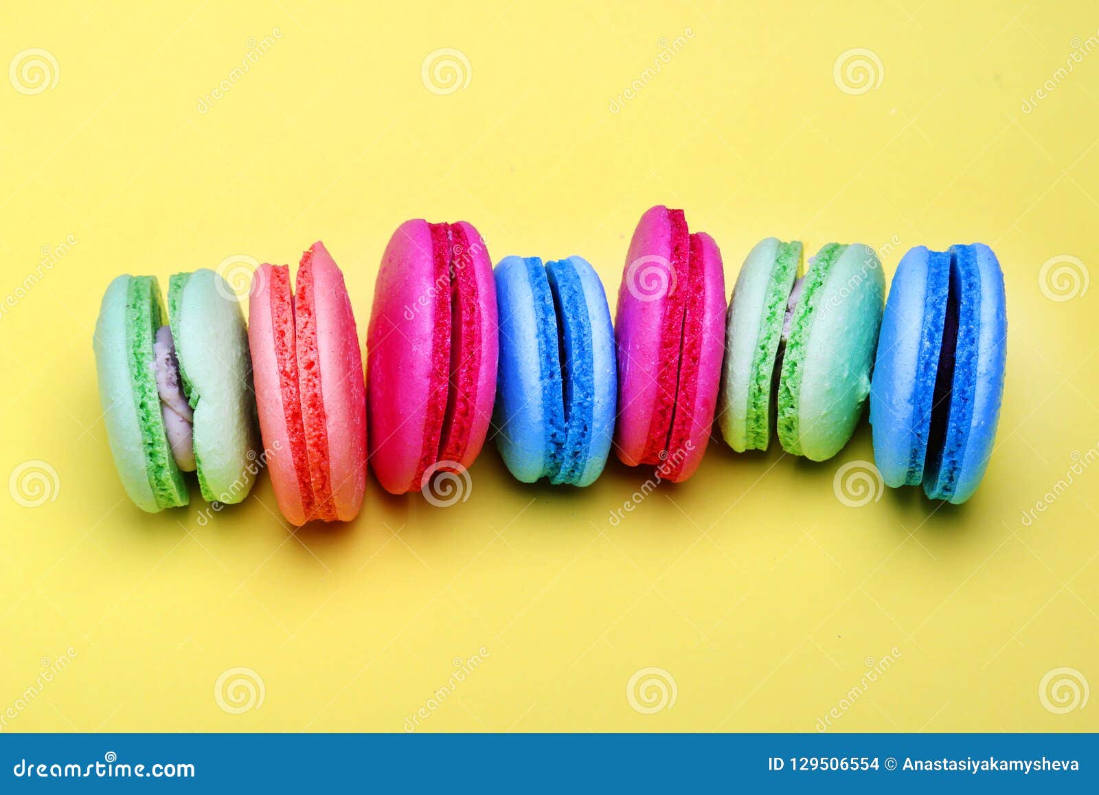A row of macarons stock photo. Image of cream, snack - 129506554