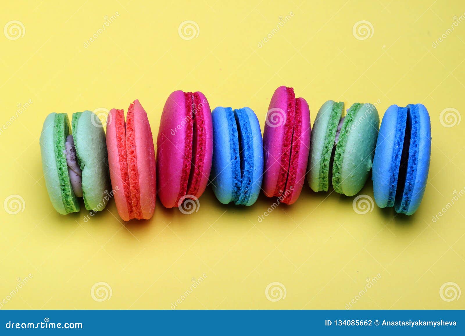 A row of macarons stock photo. Image of closeup, color - 134085662