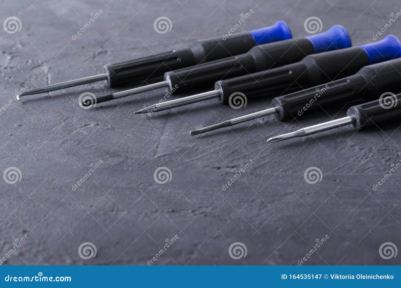 Row of Manual Small Screwdrivers on the Black Table Stock Image - Image ...