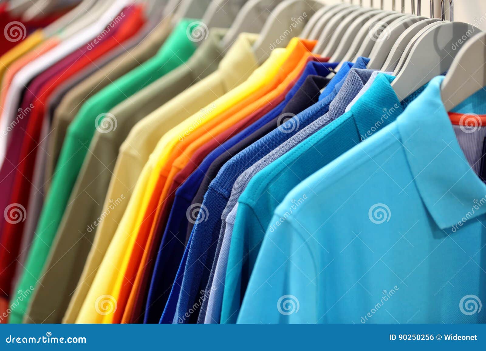 Row of Men`s Polo Shirts in Wardrobe or Store Stock Photo - Image of ...