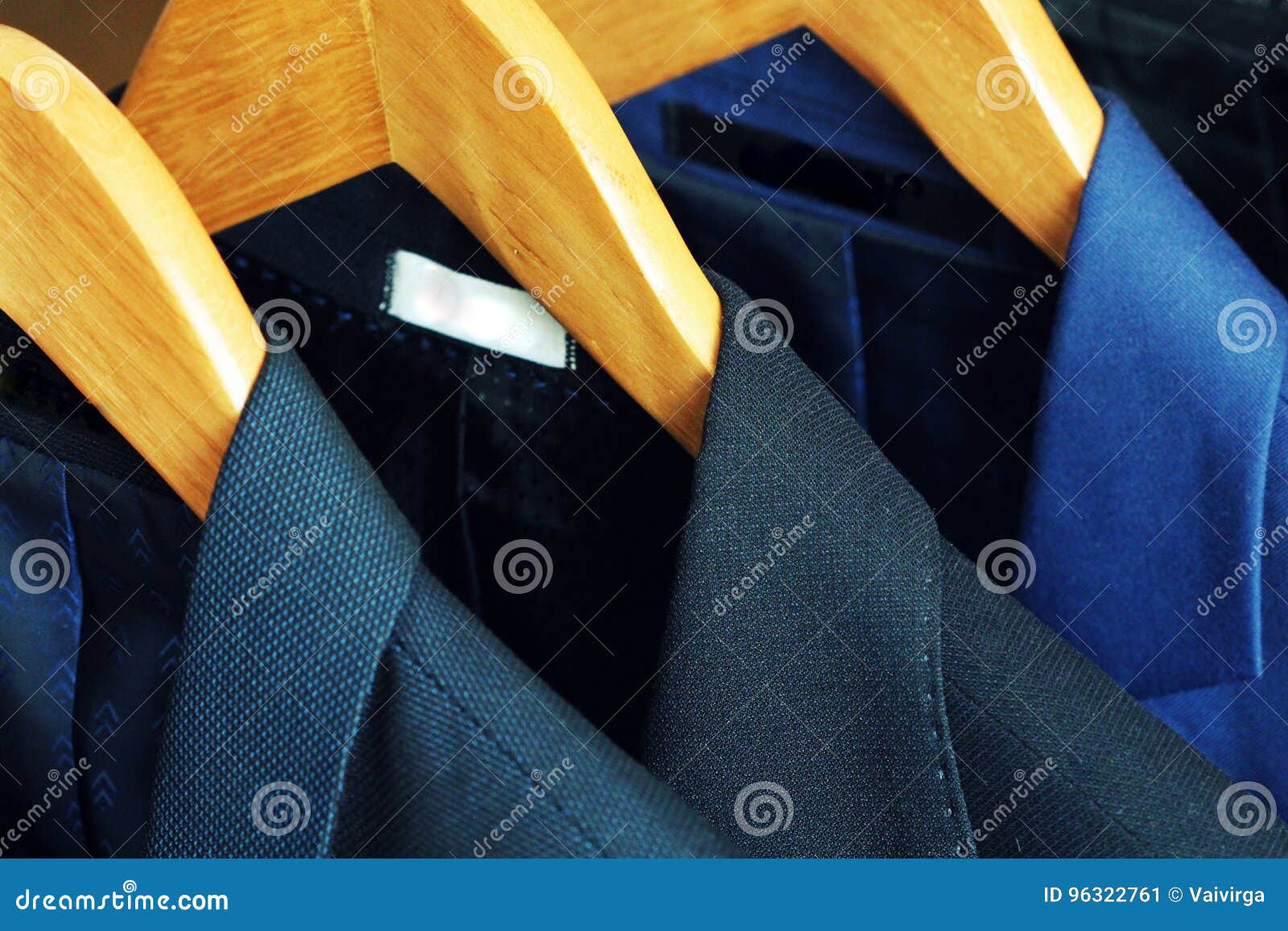 Row of Men`s Suits Hanging in Closet Stock Image - Image of clothes ...