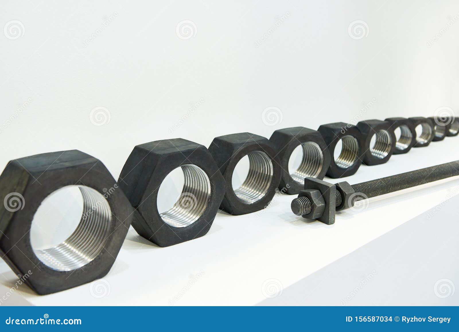 Row of metal nuts stock photo. Image of iron, isolated - 156587034