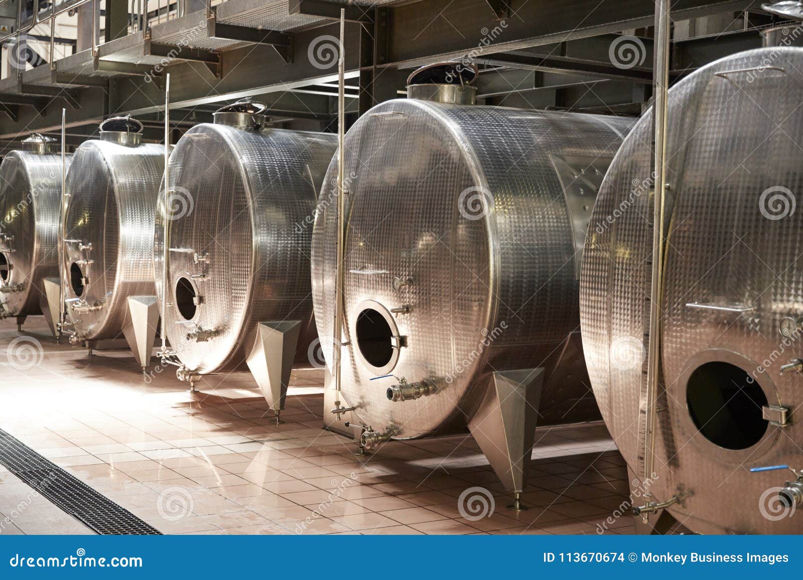 A Row of Metal Vats in a Modern Winemaking Facility Stock Photo - Image ...