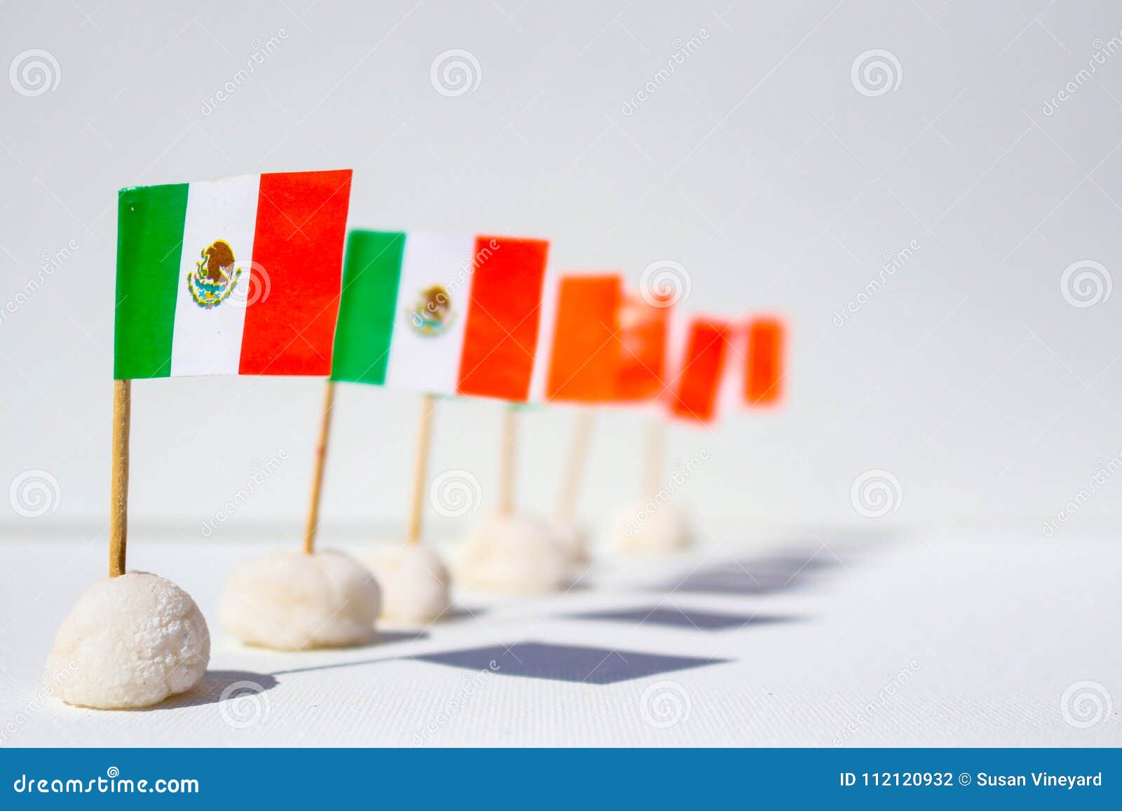 Row of Mini Mexican Flags in a Row with Interesting Shadows - Shallow ...