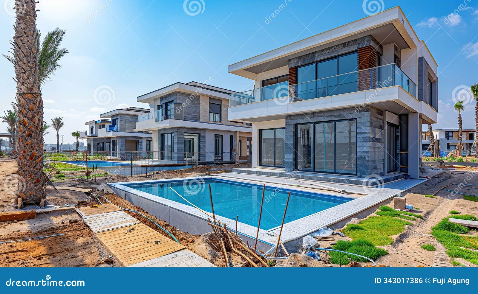 A Row of Modern, Luxury Villas Under Construction with Swimming Pools ...