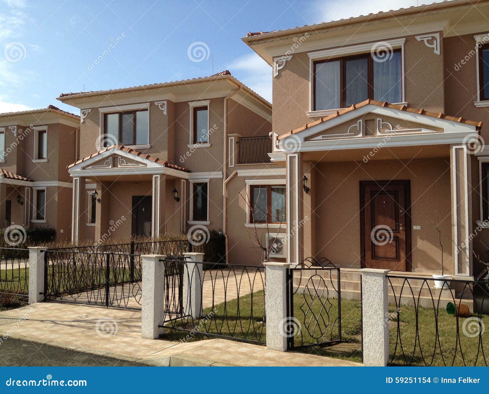 Row of modern townhouses stock photo. Image of private - 59251154