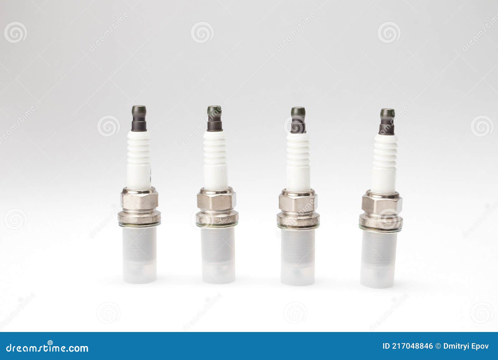 A row of new spark plugs stock photo. Image of connection - 217048846