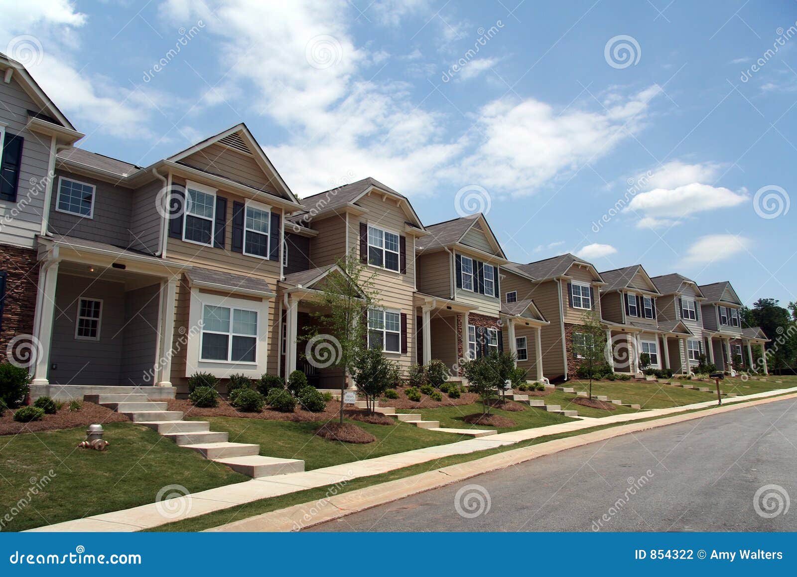 A Row of New Townhouses or Condominiums Stock Photo - Image of leasing ...