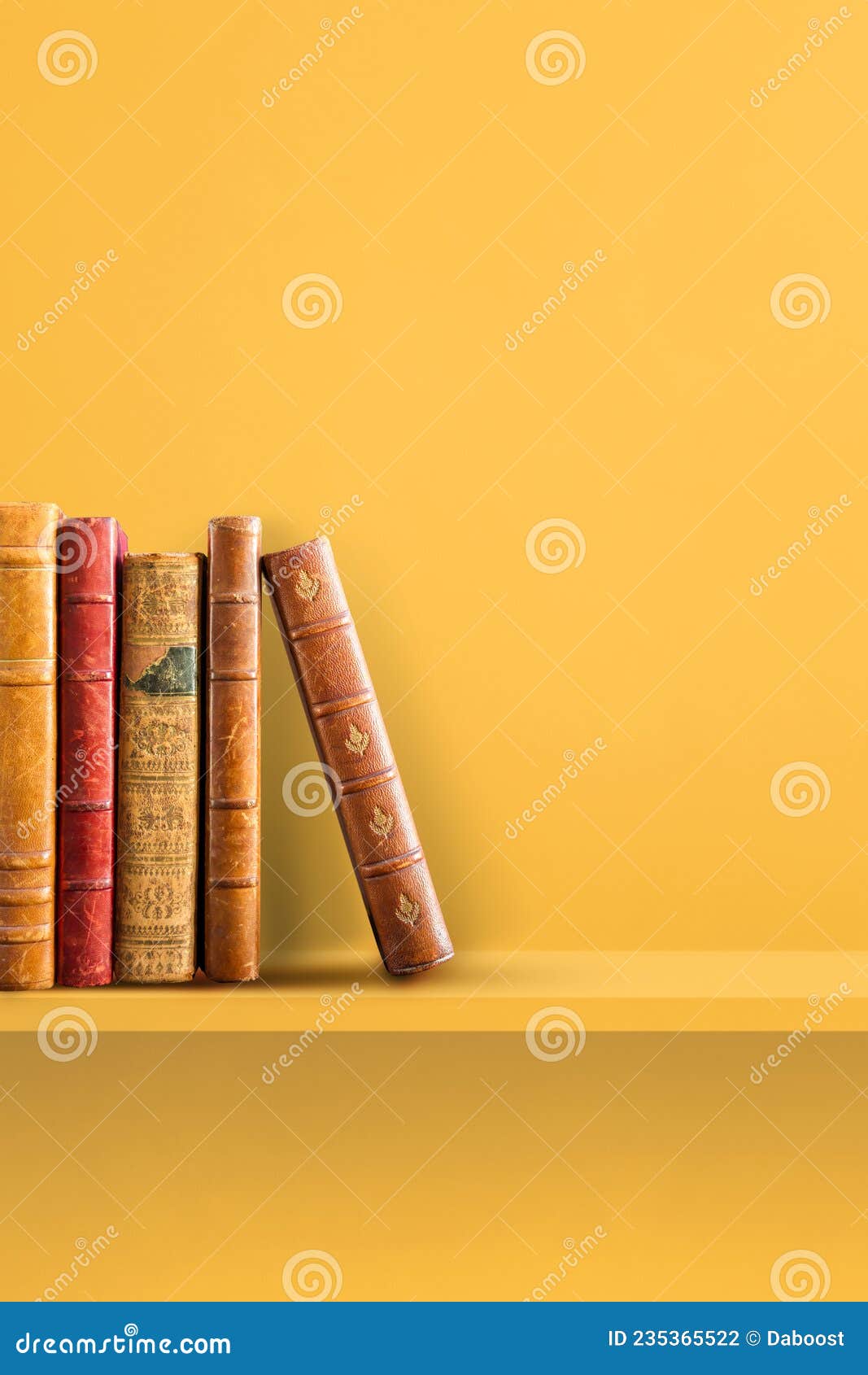 Row of Old Books on Yellow Shelf. Vertical Background Stock Photo ...