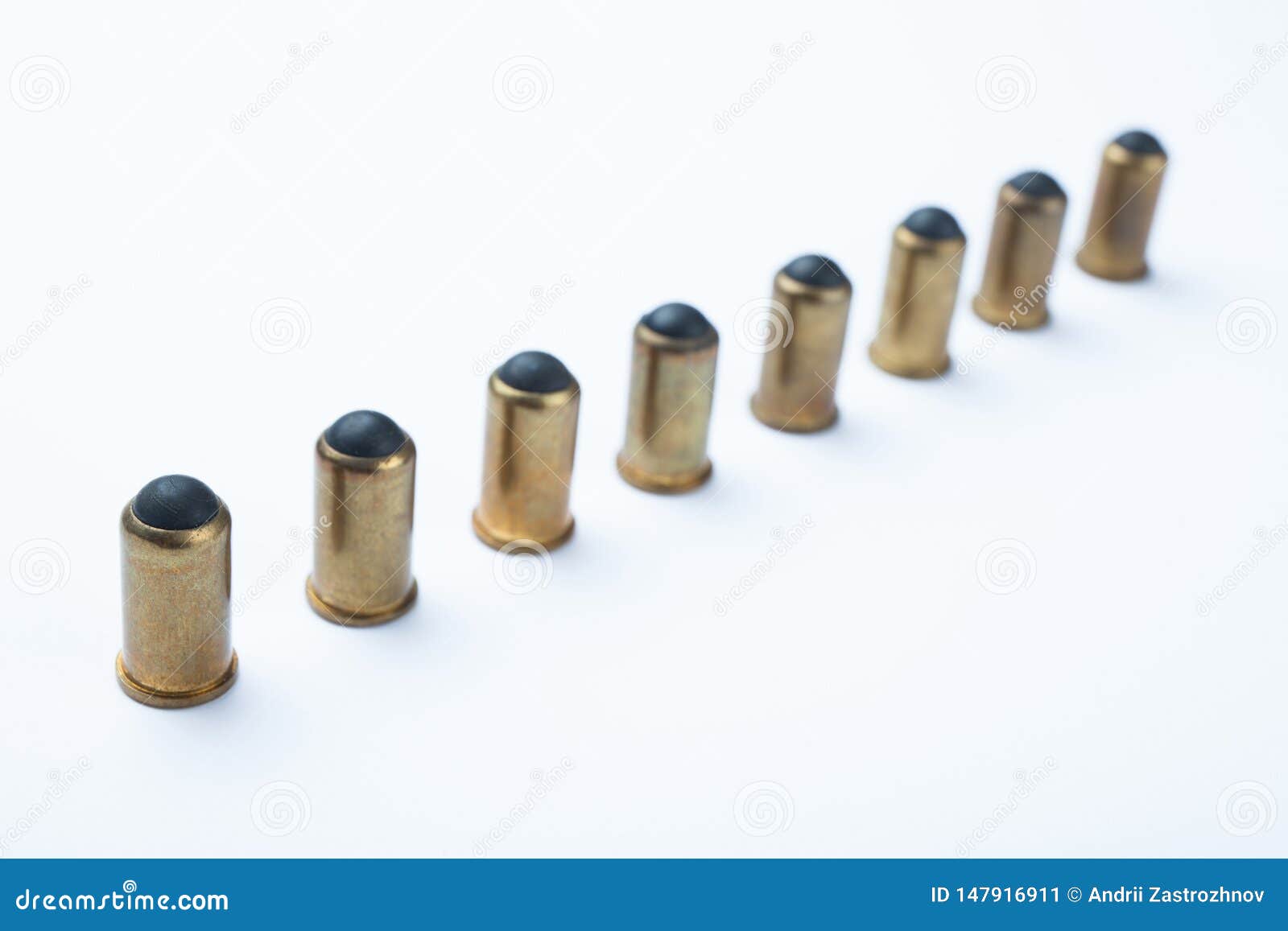 A Row of Old Rubber Bullets on a White Background Stock Image - Image ...