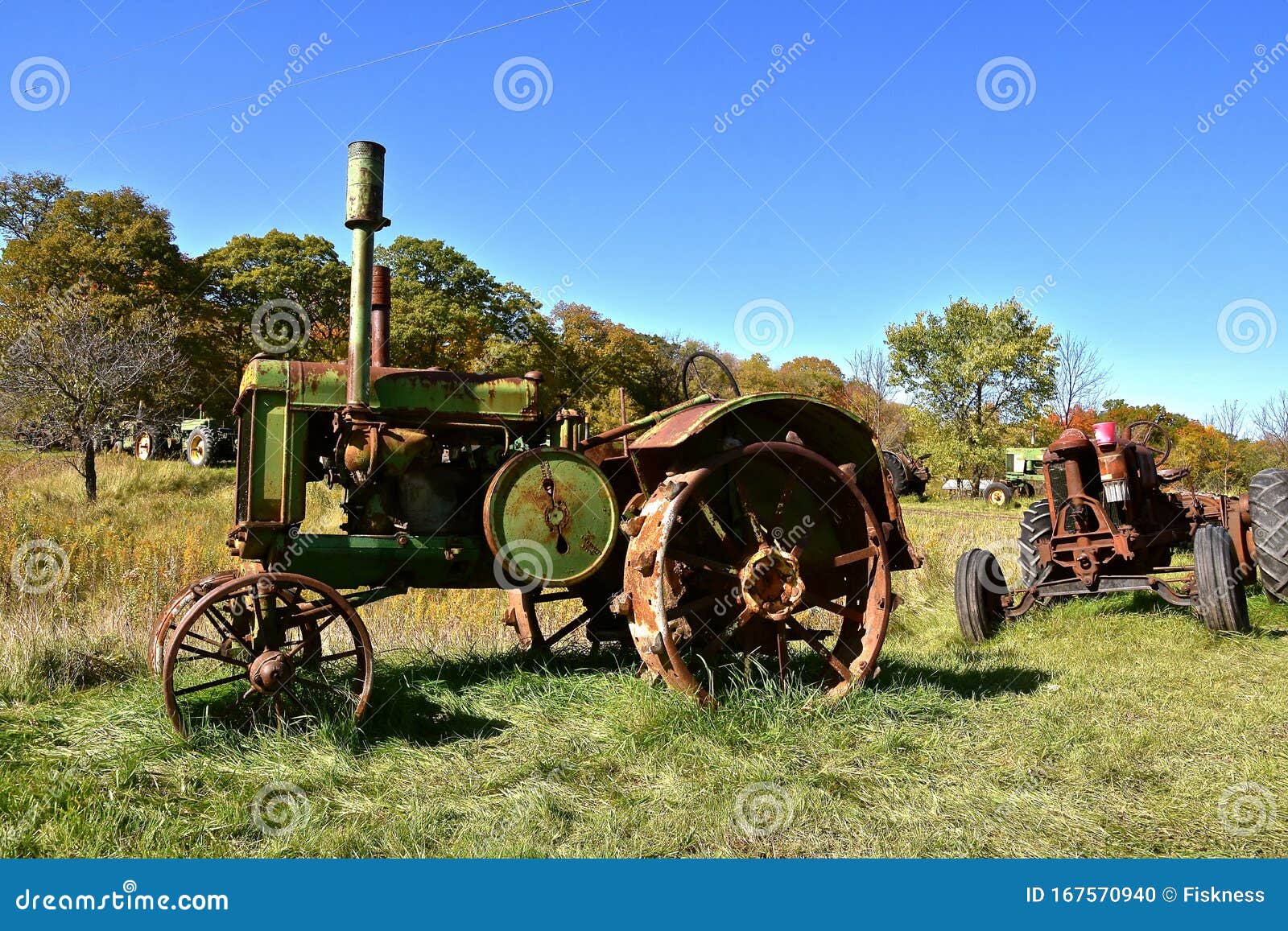 Row of old rusty tractors stock photo. Image of farmer - 167570940