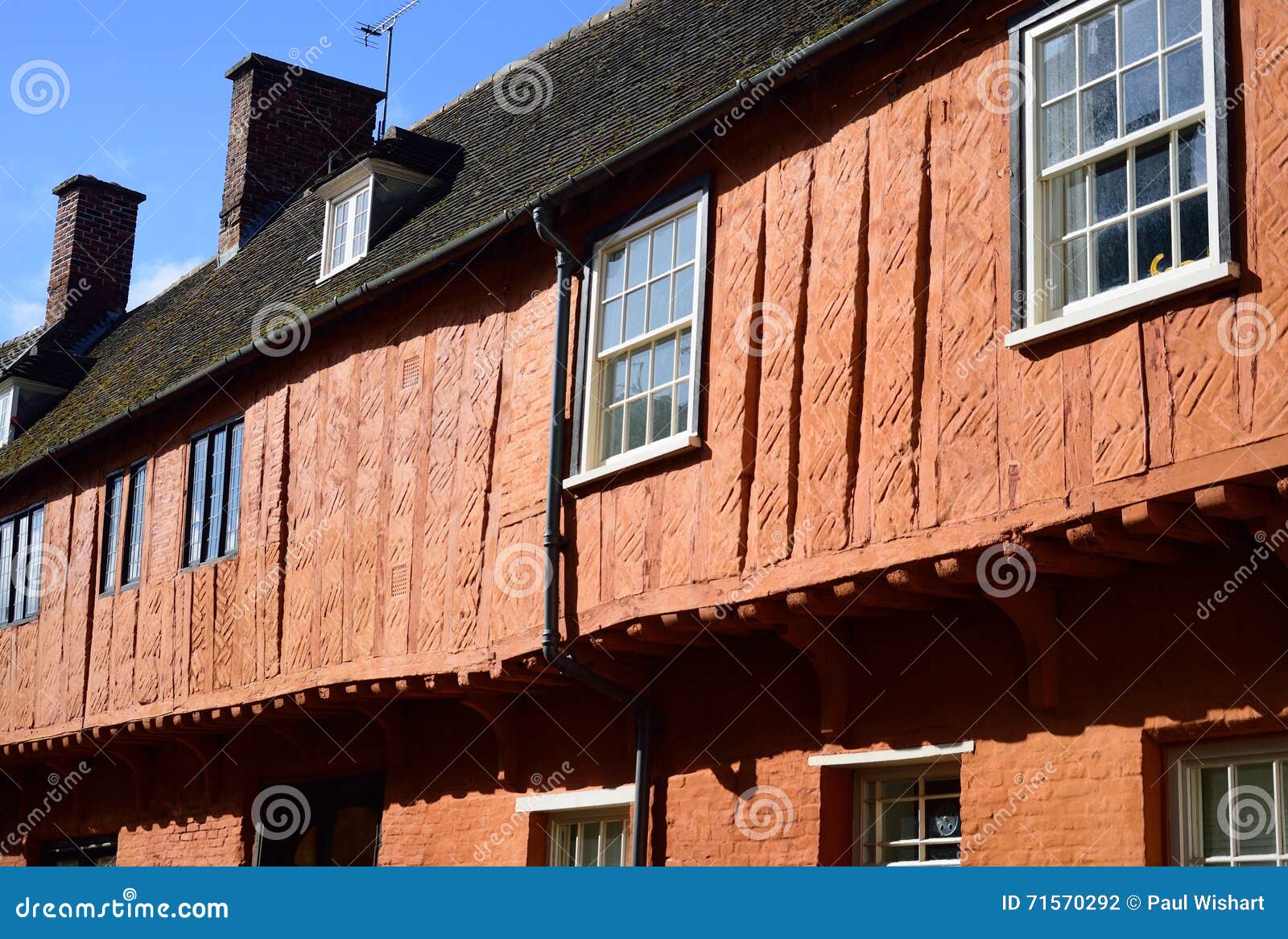Row of Orange cottages stock photo. Image of facade, street - 71570292