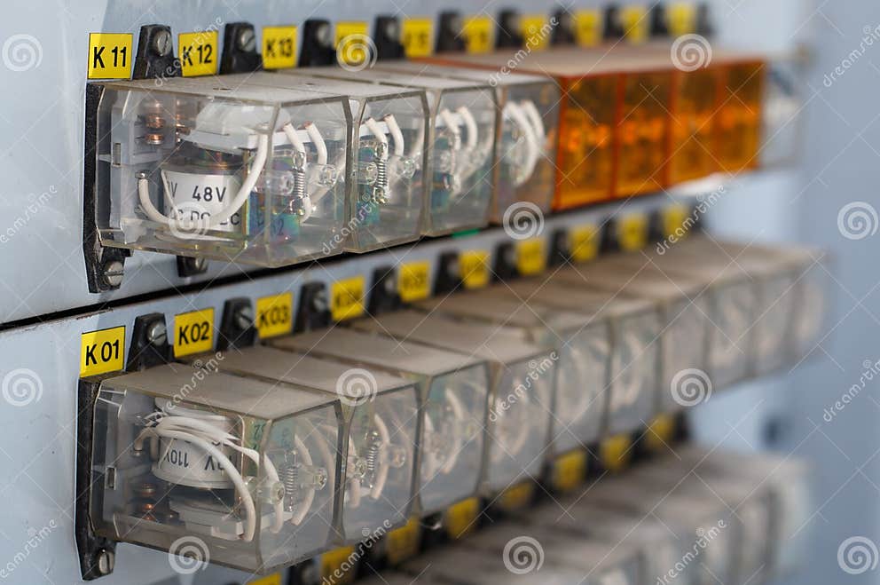 Row of Orange and White Relay Actuators Stock Image - Image of electric ...