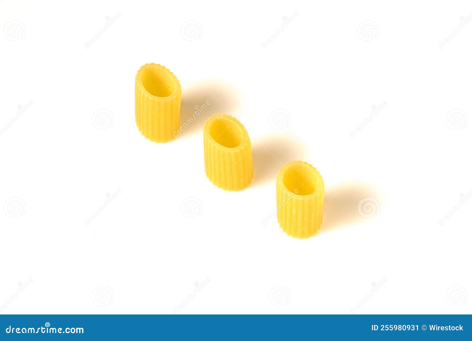 Row of Pacheri Pasta Pieces on a White Surface Stock Image - Image of ...