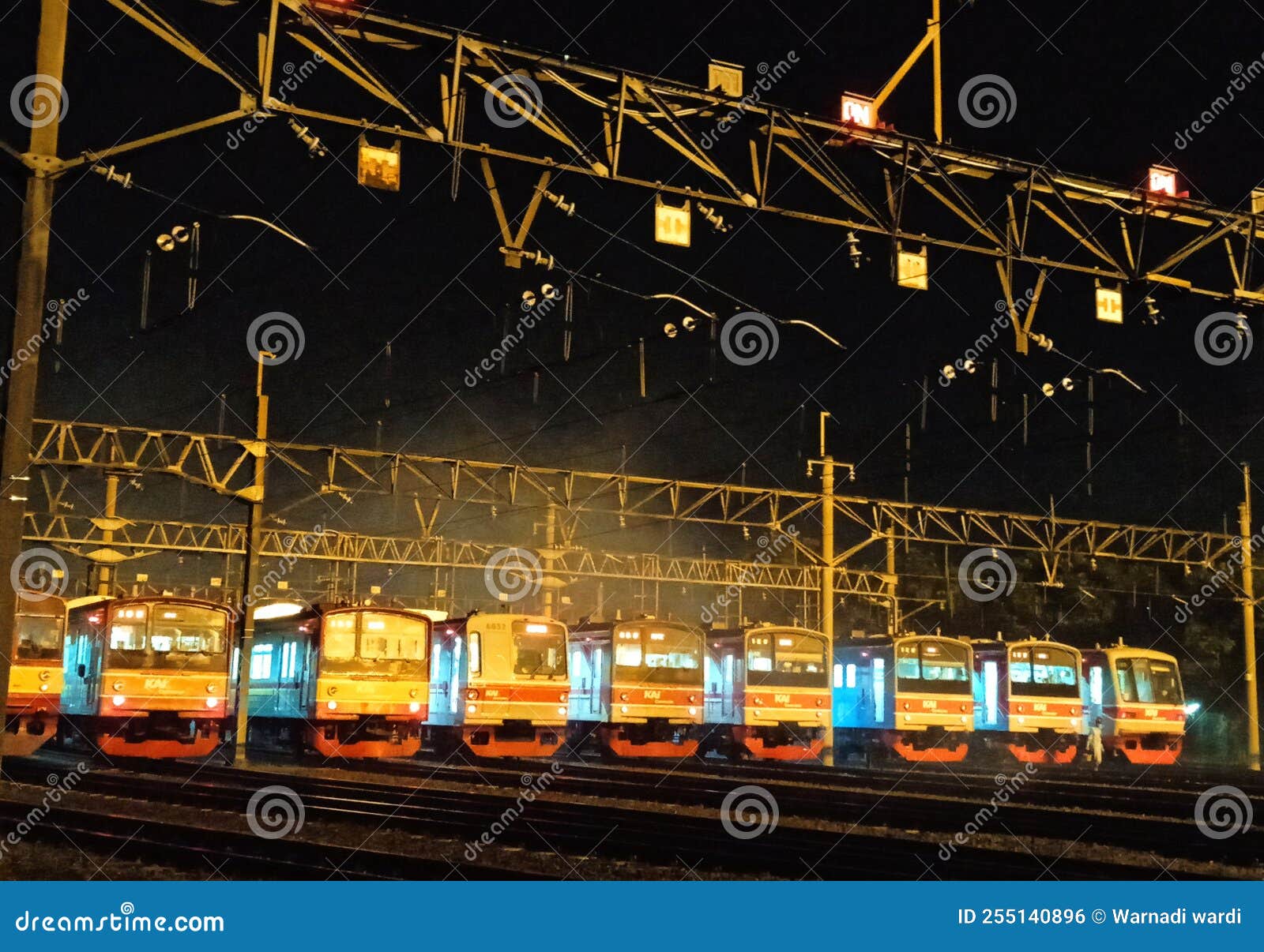 A row of parked trains stock photo. Image of night, transport - 255140896