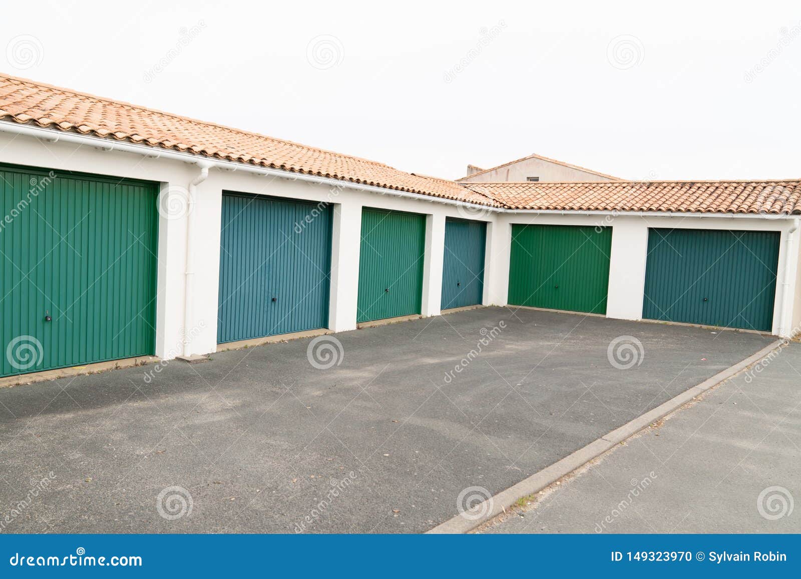 Row of Parking Garages Car with Green Doors Stock Photo - Image of ...
