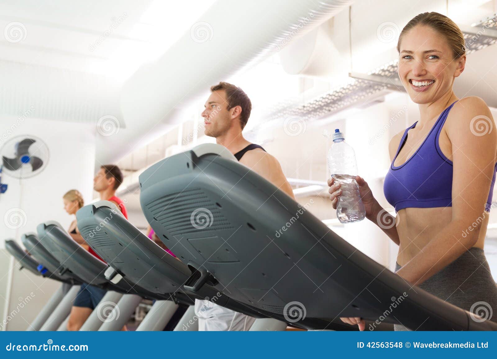 Row of People Working Out on Treadmills Stock Photo - Image of ...