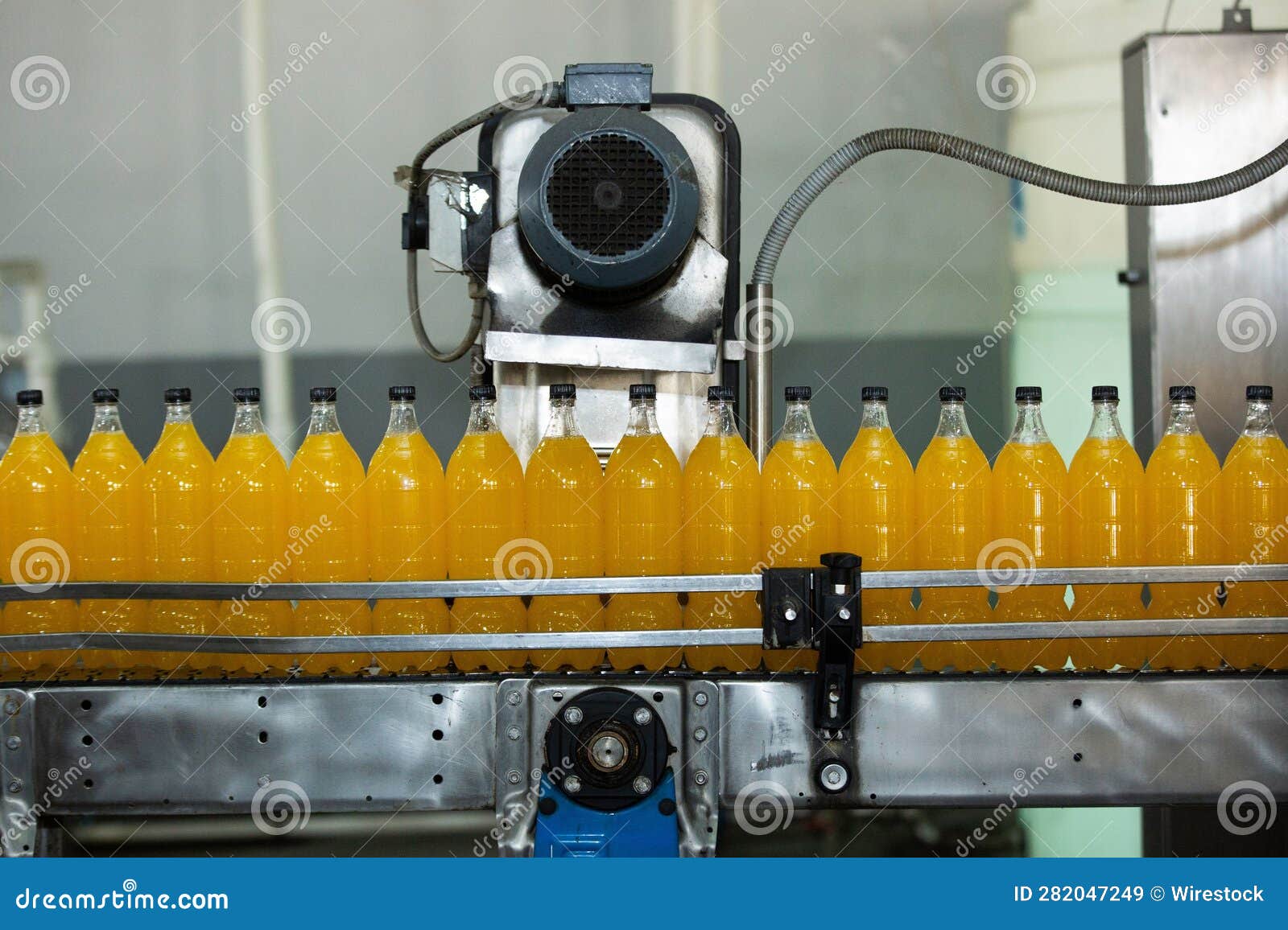 Row of Plastic Bottles Being Filled with Liquid Stock Image - Image of ...