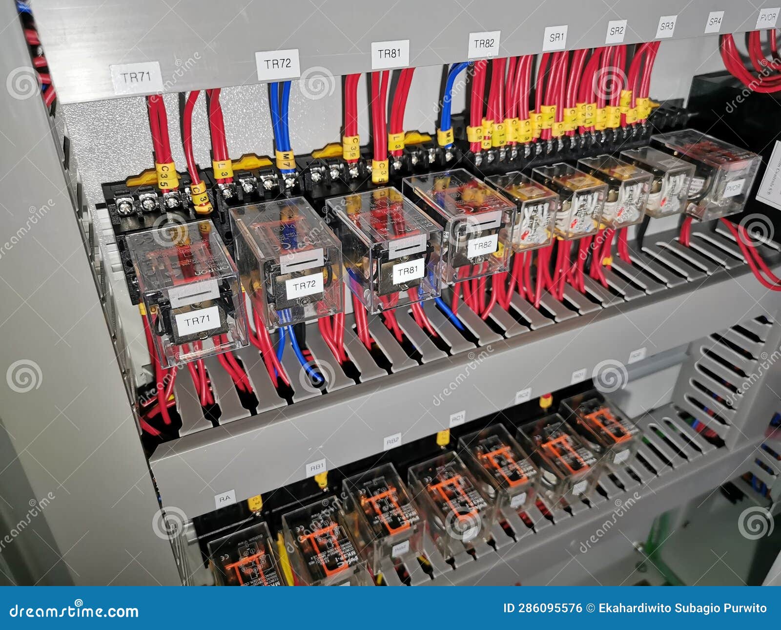 A Row of Plug in Relays with Base in Low Voltage Switchboard. Editorial ... A Row of Plug in Relays with Base in Low Voltage Switchboard. Editorial ...