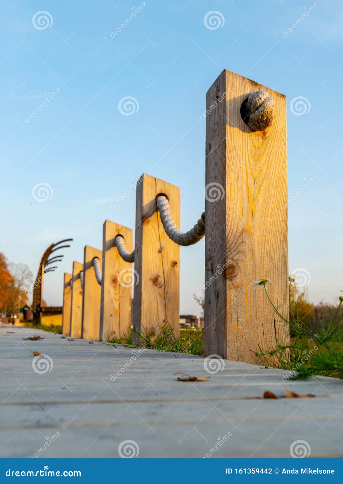 Row of Poles Along Pedestrian Path Stock Photo - Image of autumn ...