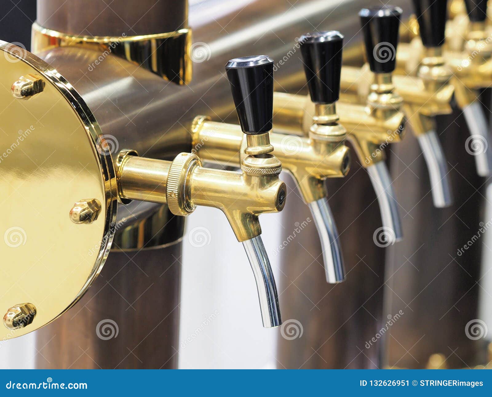 Row of polished beer taps stock image. Image of pipework - 132626951