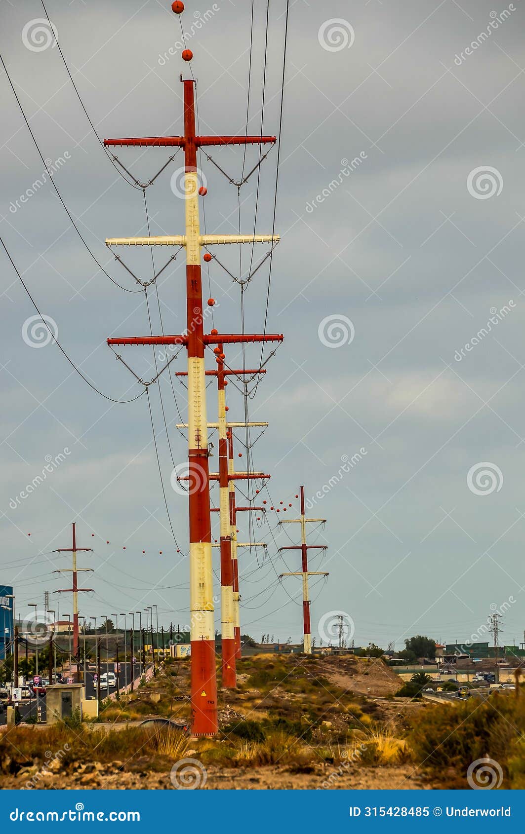 A Row of Power Lines with Red and White Poles Stock Image - Image of ...