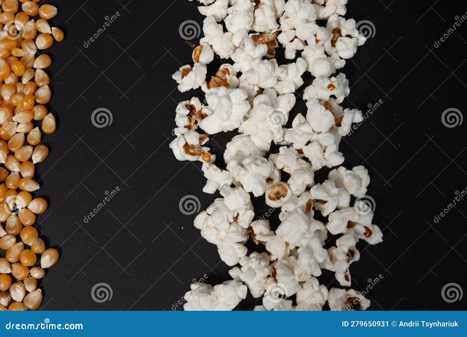 A Row of Ready-made Popcorn and a Row of Corn Kernels on a Black ...