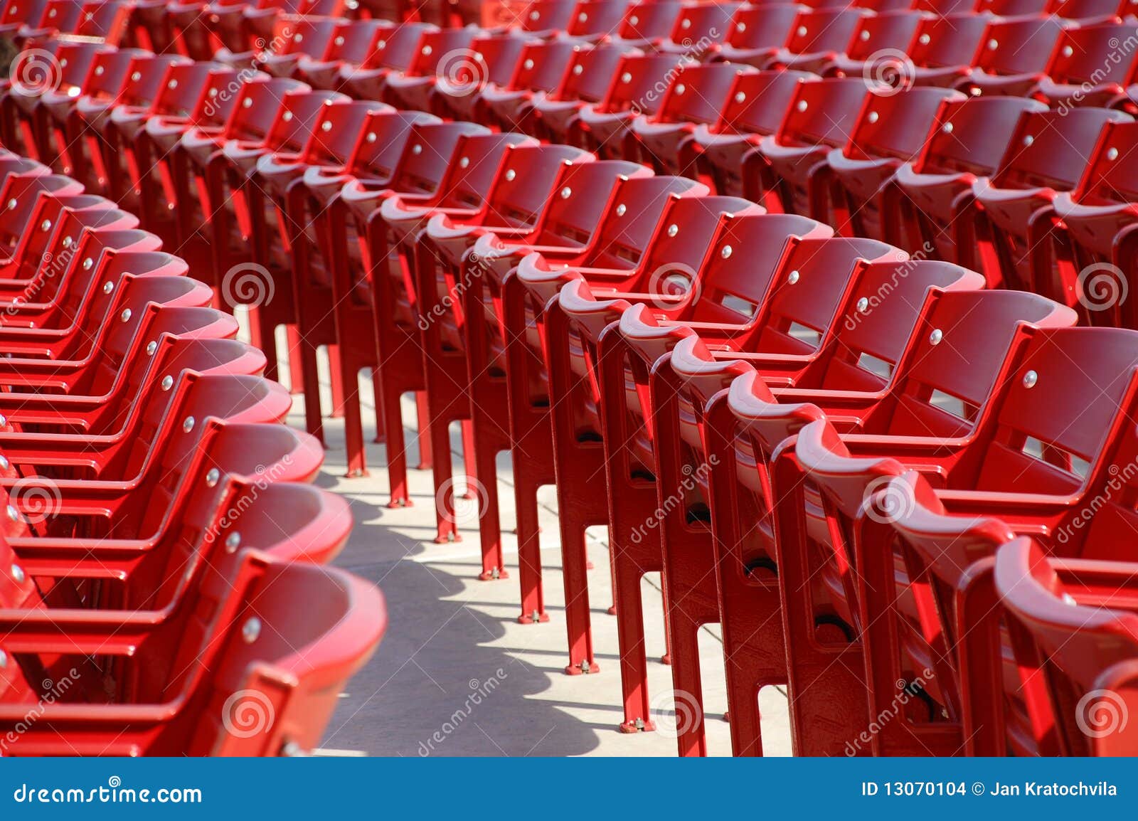 Row of red chairs rounded stock photo. Image of hall - 13070104