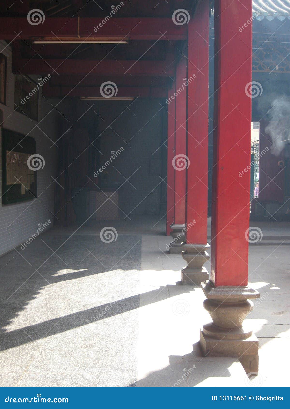 Row of red columns stock image. Image of sunlight, pillars - 13115661