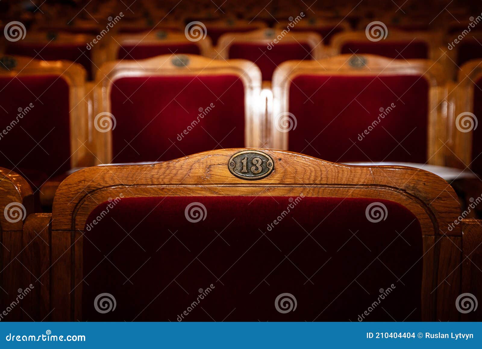 Row of red seats stock photo. Image of architecture - 210404404