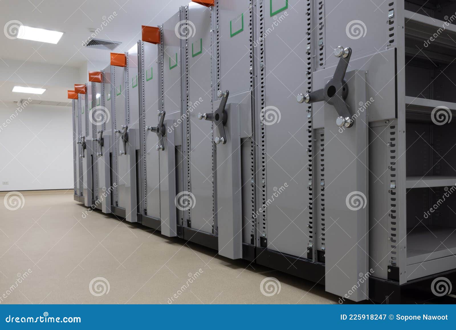 A Row of Revolving Metal Storage Shelves Stock Image - Image of office ...