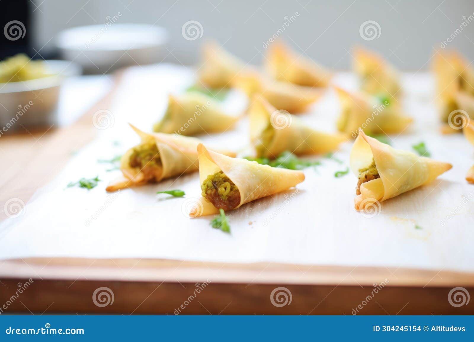 Row of Samosas Cooling on Parchment Paper Stock Photo - Image of fried ...