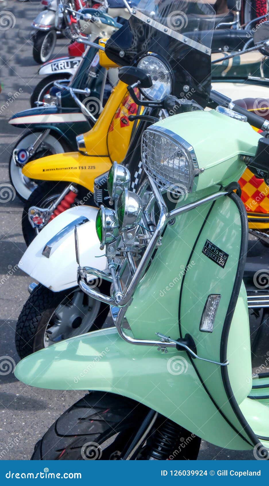 A Row of Seven Mopeds Front Wheels Editorial Stock Image - Image of ...