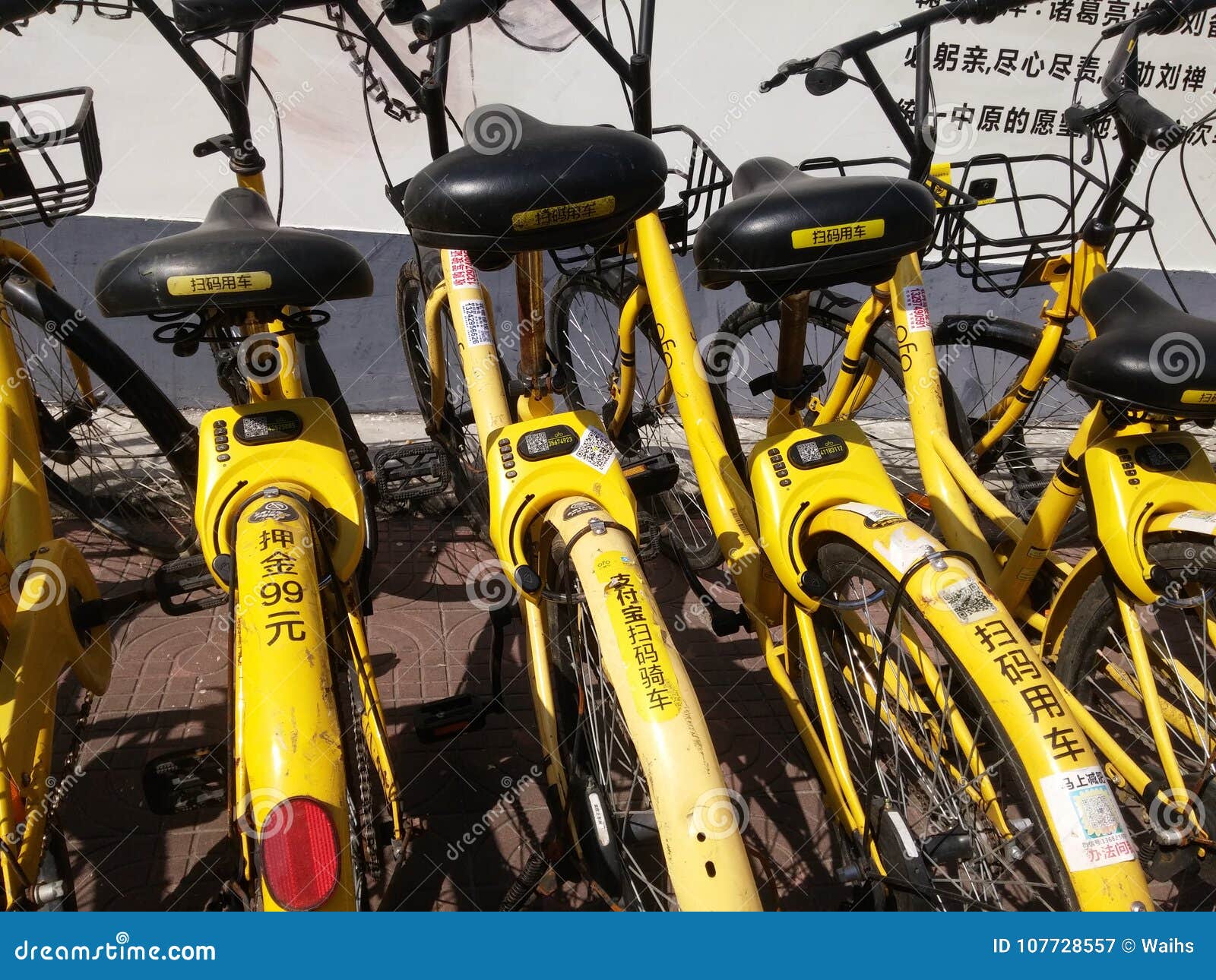 Shenzhen, China: a Row of Shared Bicycles Parked on the Sidewalk ... Shenzhen, China: a Row of Shared Bicycles Parked on the Sidewalk ...
