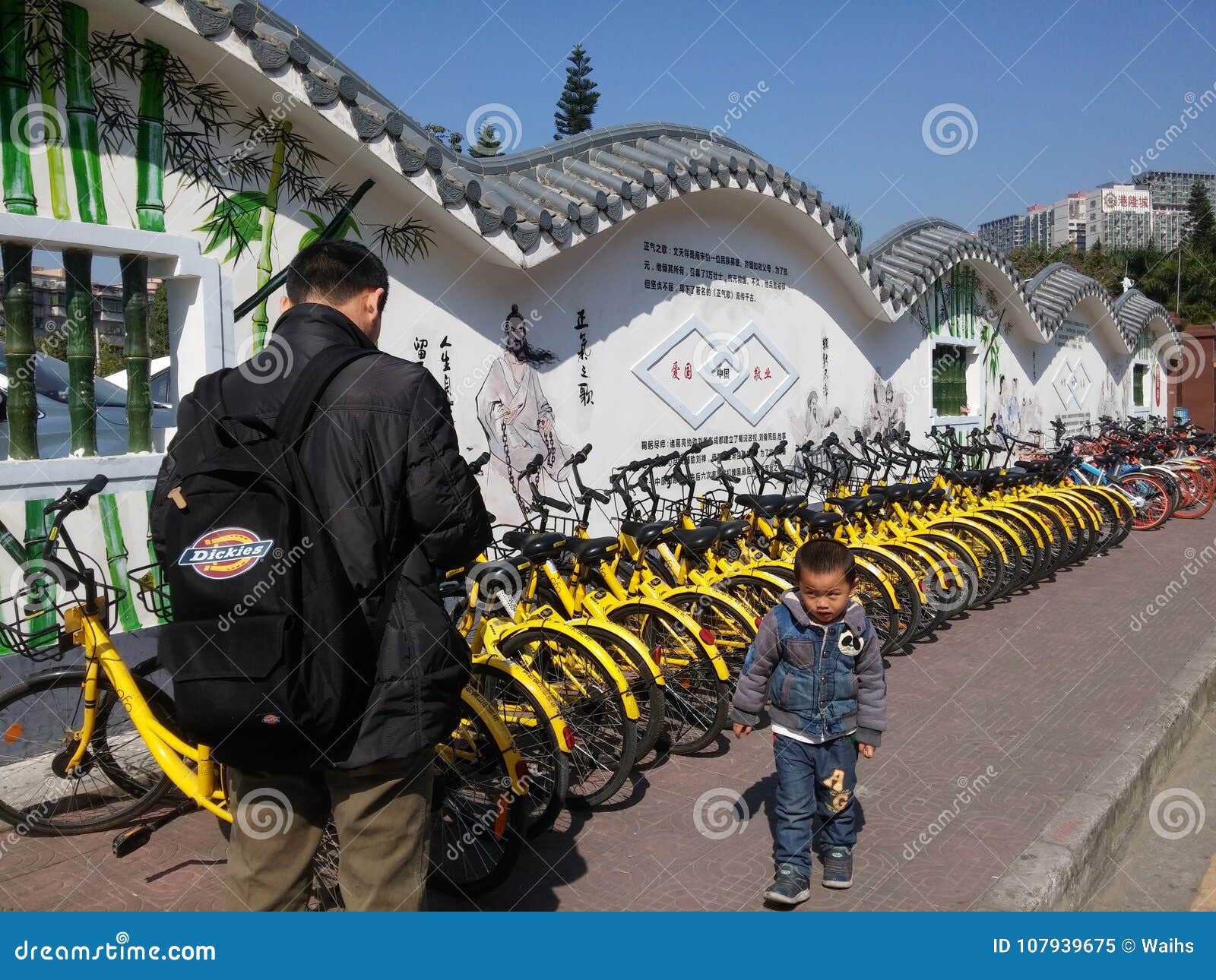 Shenzhen, China: a Row of Shared Bicycles Parked on the Sidewalk ... Shenzhen, China: a Row of Shared Bicycles Parked on the Sidewalk ...