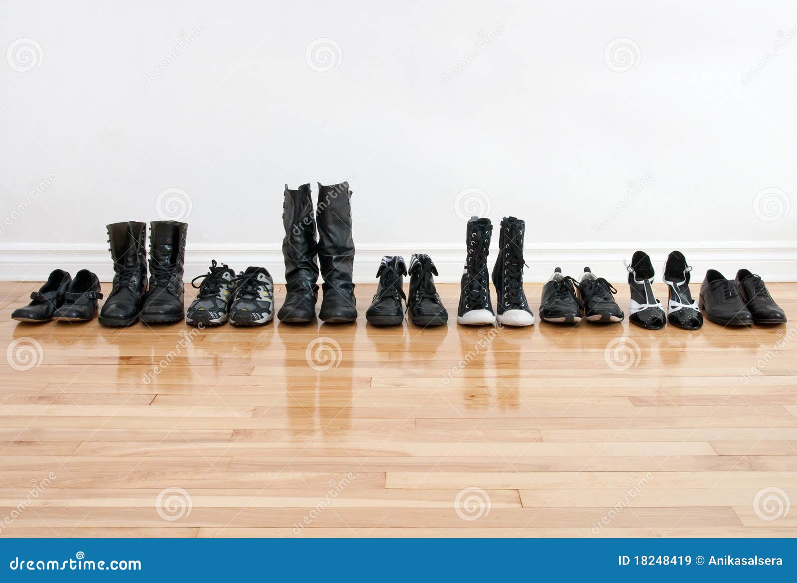 Row of Shoes and Boots on a Wooden Floor Stock Image - Image of fashion ...