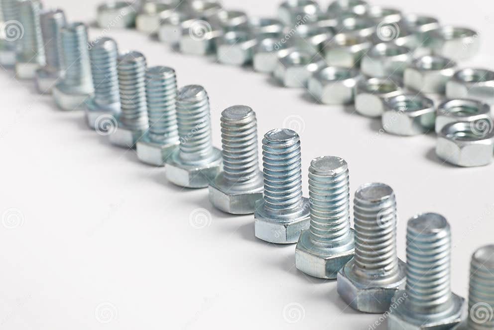 Row of Silver Steel Bolts with a Single Nut Stock Photo - Image of ...