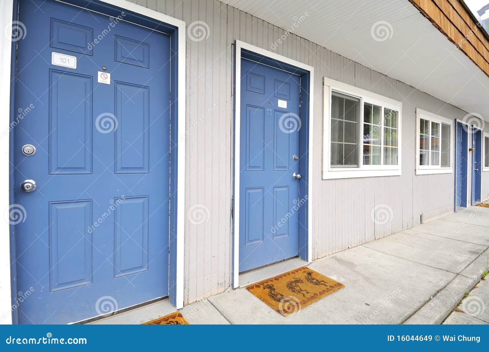 Row of simple hotel rooms stock image. Image of cement - 16044649