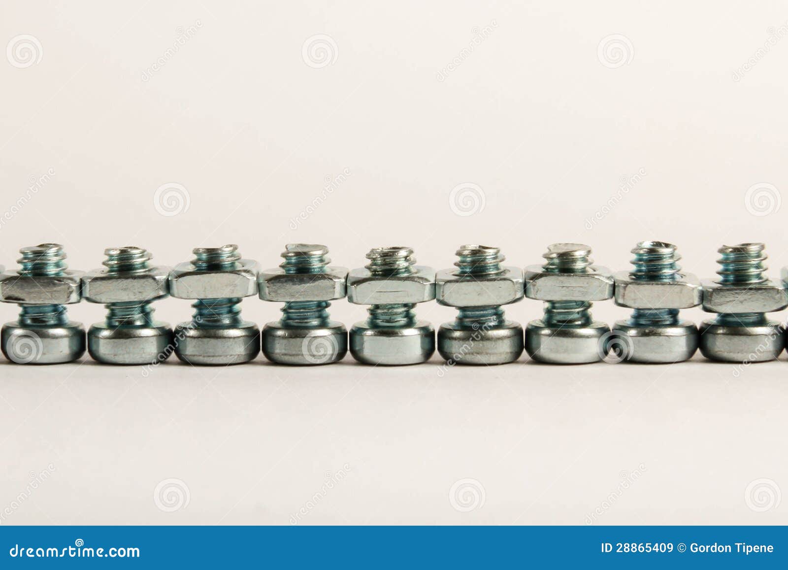 Row of Small Steel Nuts and Bolts Stock Image - Image of tools ...
