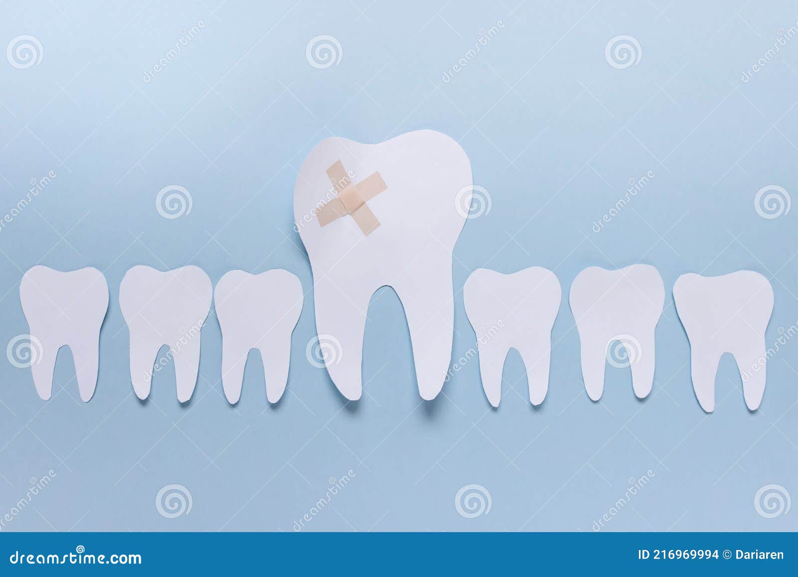 Row of Small Tooth with One Large Tooth with Patch Stock Photo - Image ...