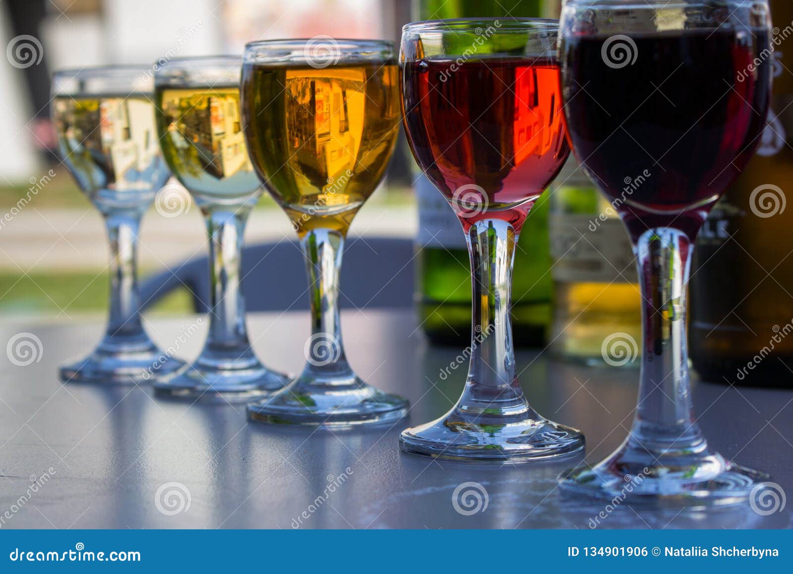 Row Of Small Wine Glasses With Different Wine Glasses With White Rose And Red Wine Wine Set