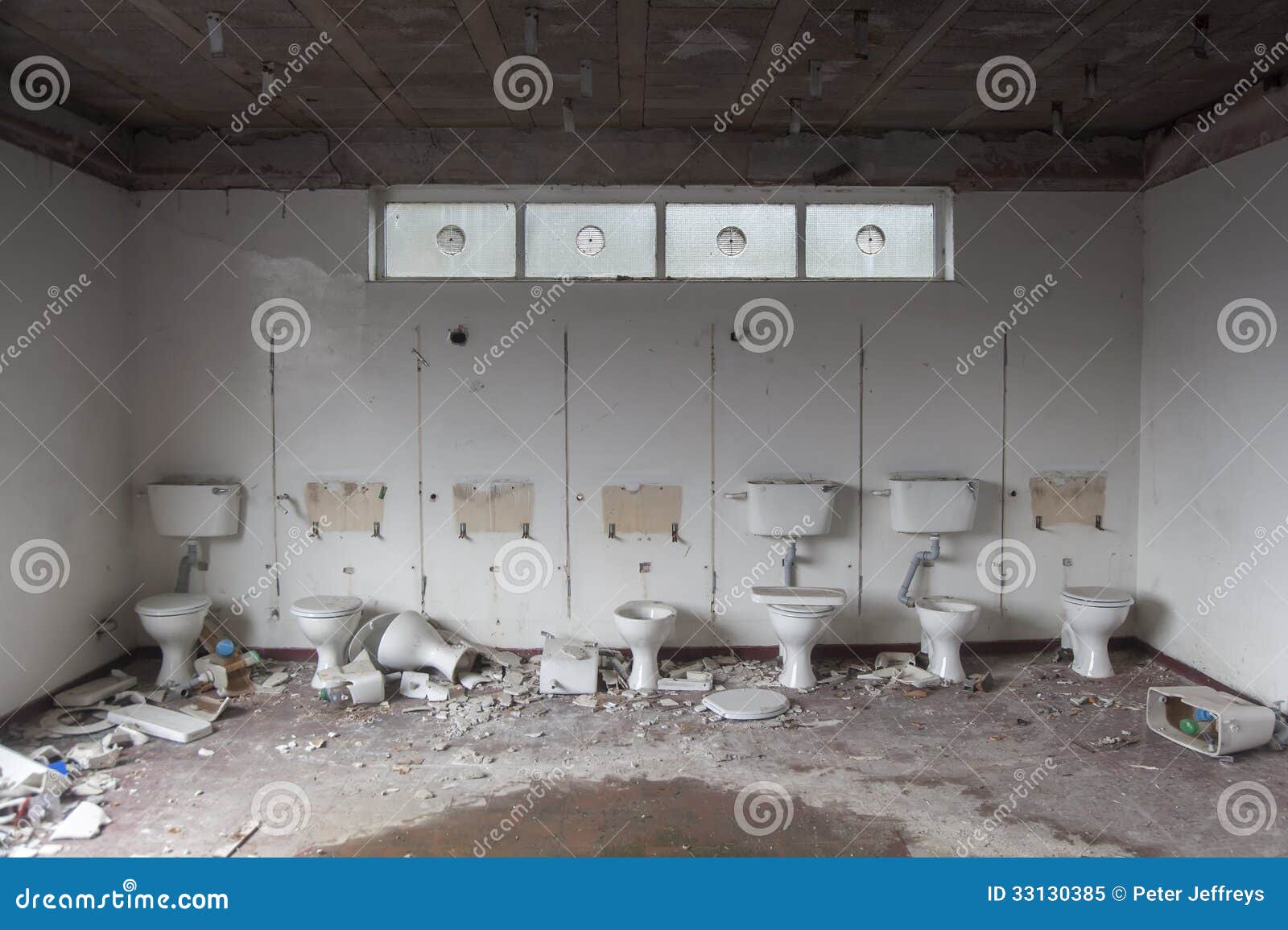 Row of smashed toilets stock image. Image of porcelain - 33130385