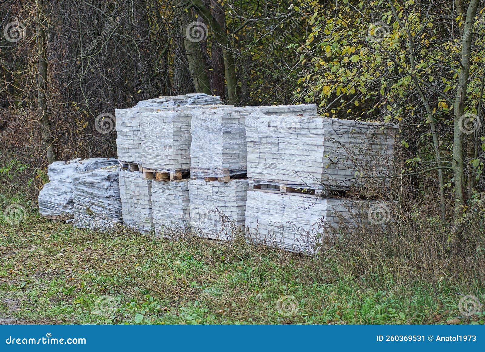 Row on Square Boxes in Plastic Packaging with Paving Bricks Stock Image ...