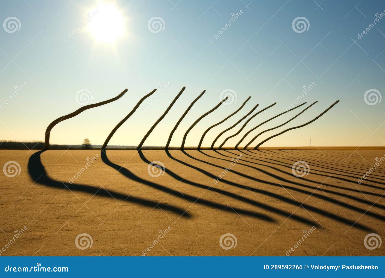 Row of Sticks in the Sand with the Sun in the Background. Generative AI ...