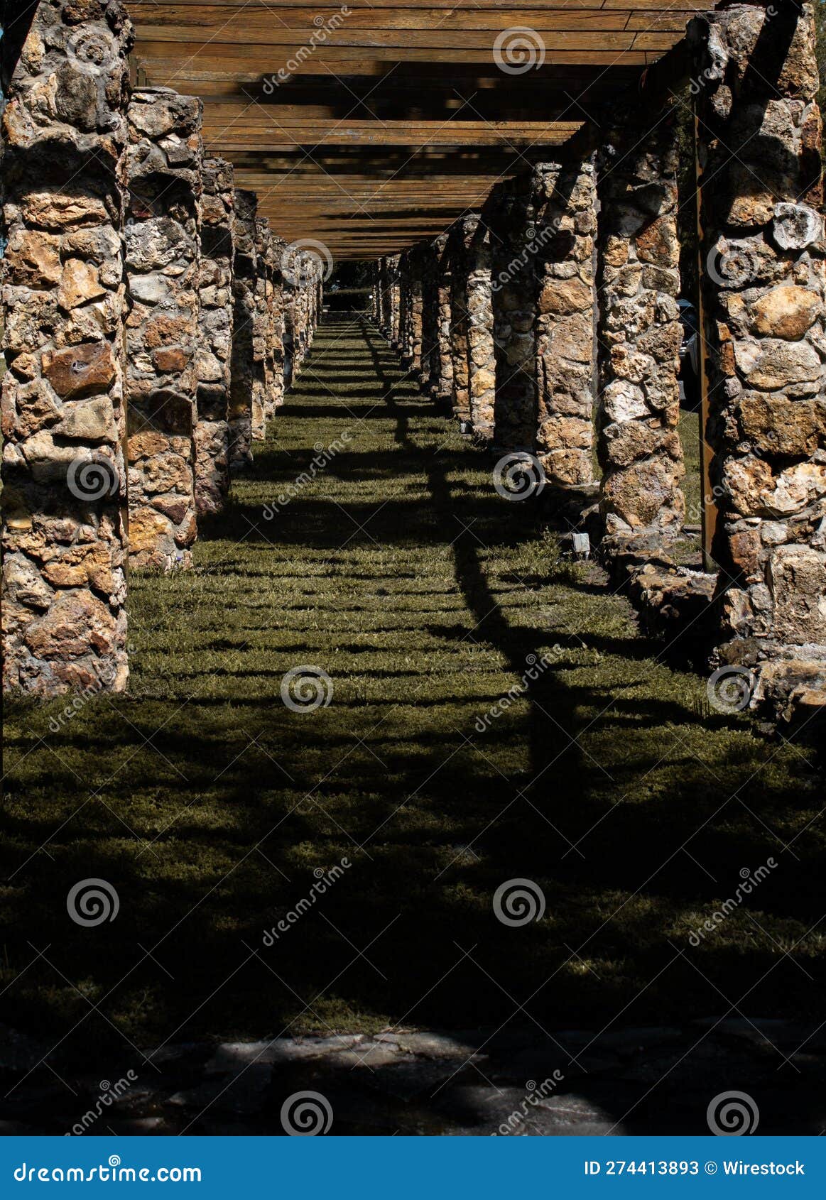 Row of Stone Archways Forming a Pathway in a Forested Area Stock Image ...
